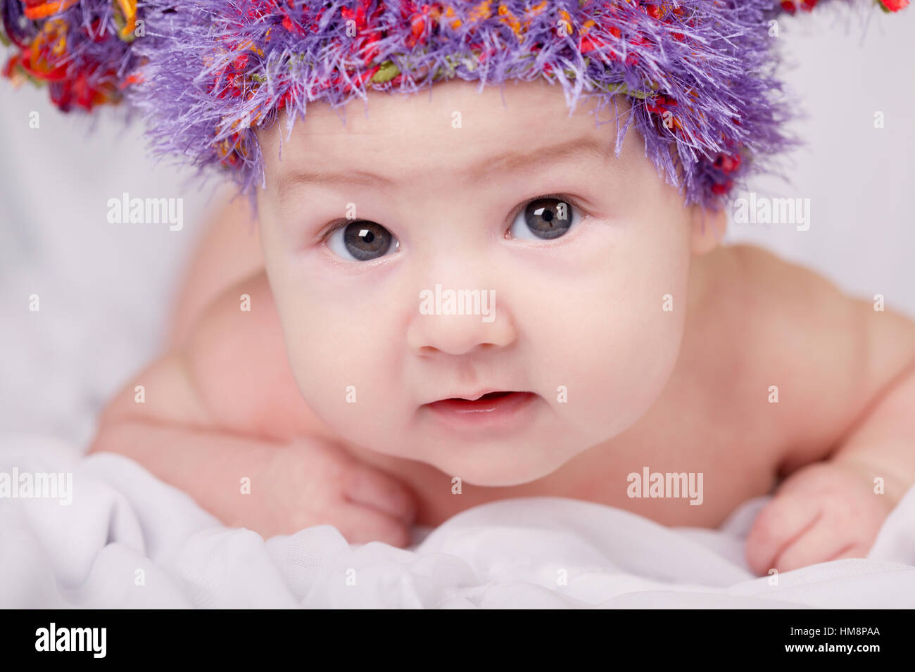cute baby in colorful hat Stock Photo - Alamy