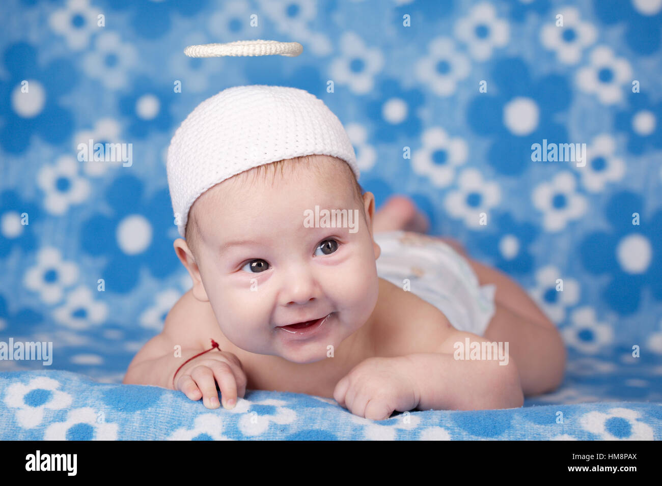 cute angel baby on blue background Stock Photo - Alamy
