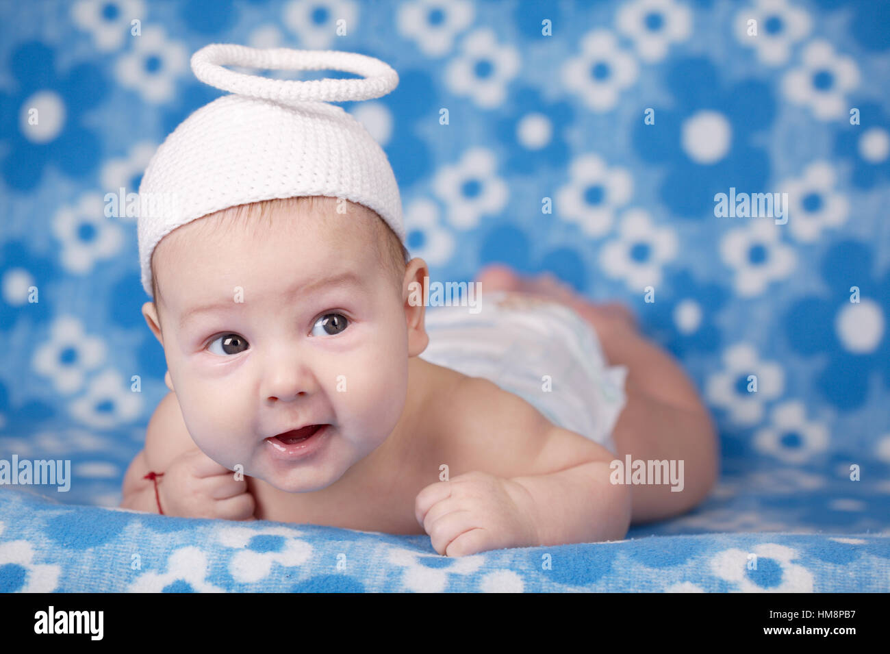 cute angel baby on blue background Stock Photo - Alamy