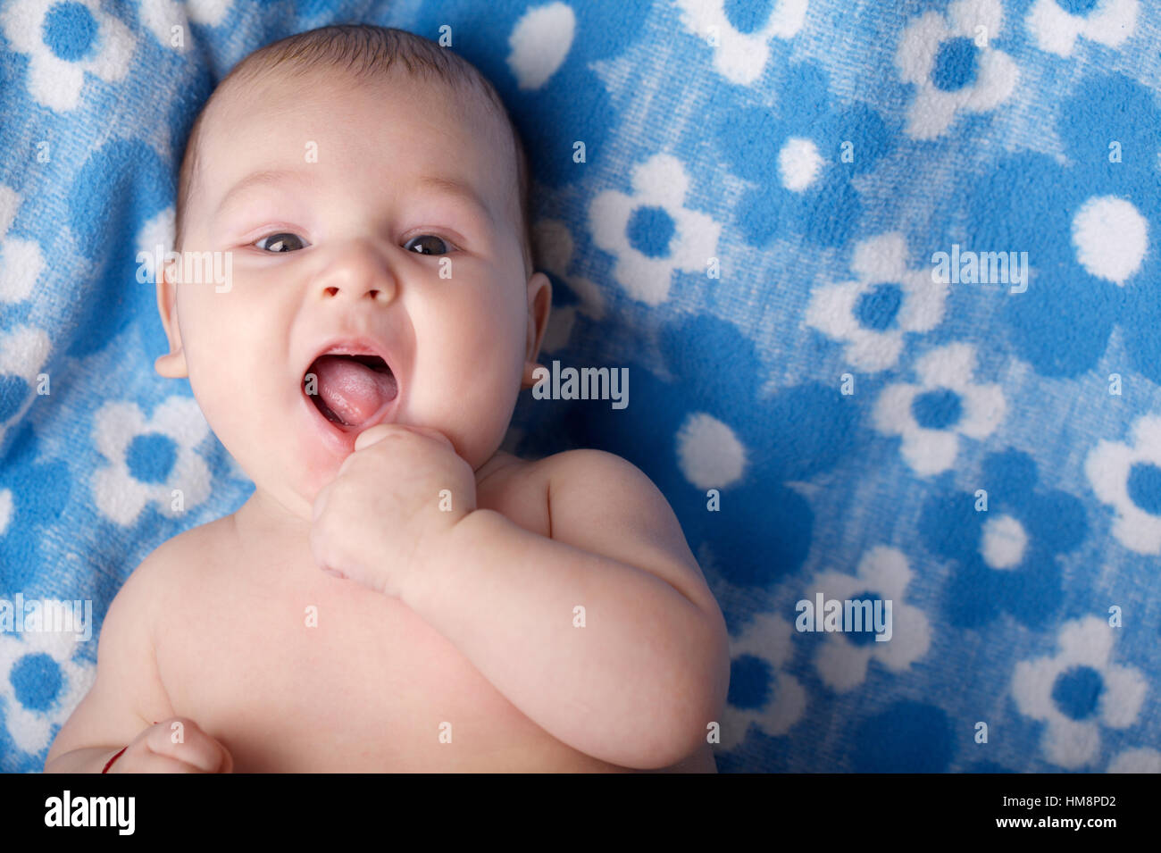 cute little boy on blue background Stock Photo - Alamy