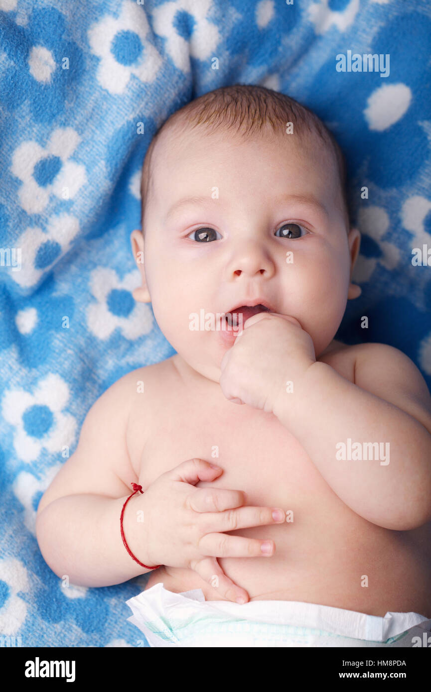 cute little boy on blue background Stock Photo - Alamy