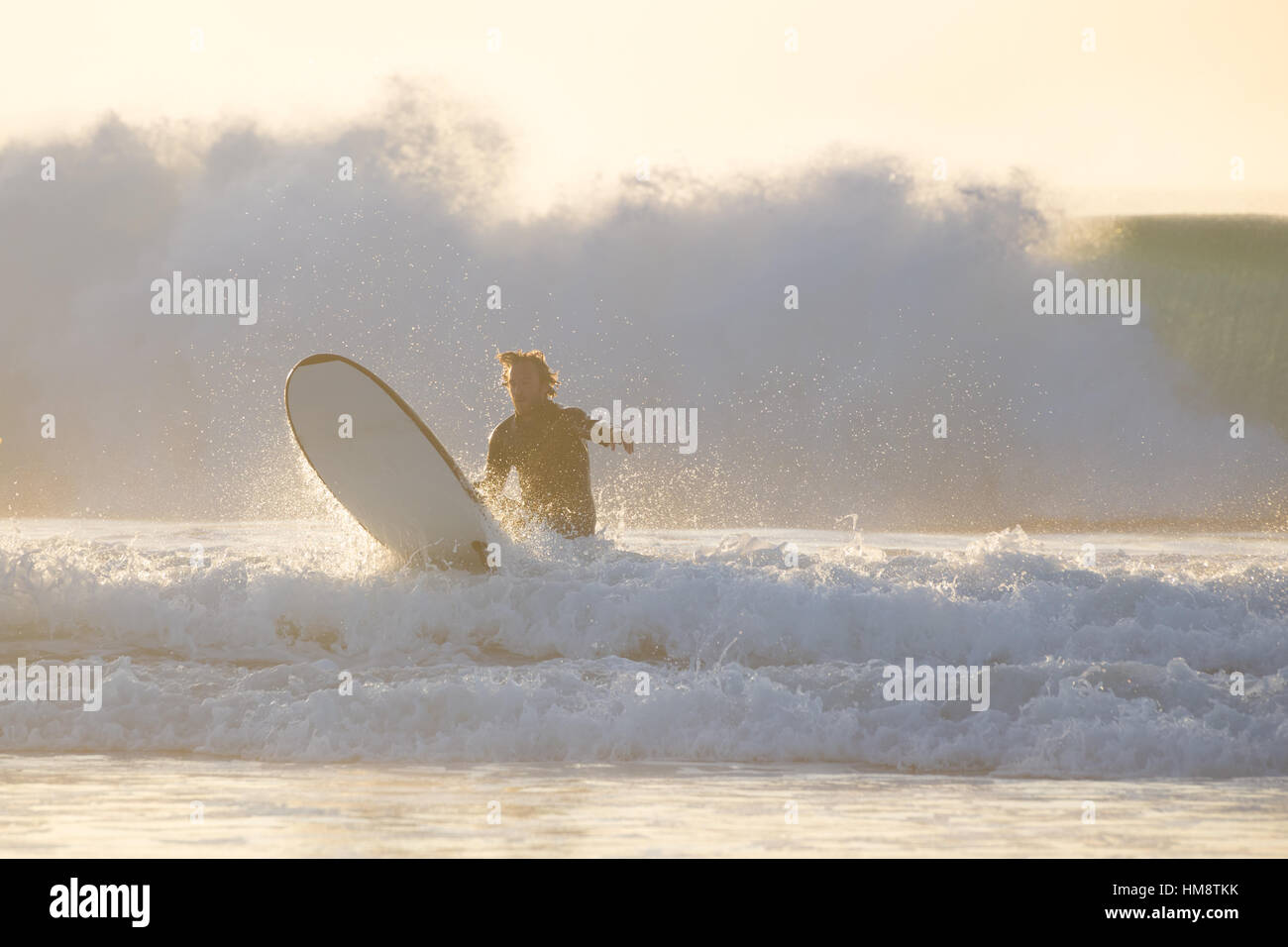 Body surfer riding a perfect wave Stock Photo - Alamy