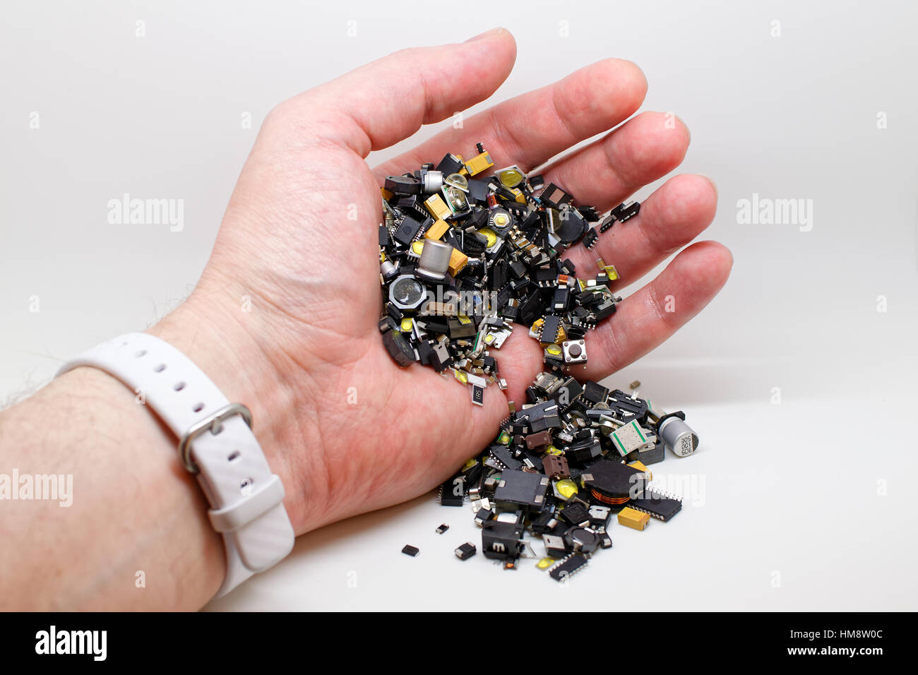 Hand full of electronics components Stock Photo - Alamy