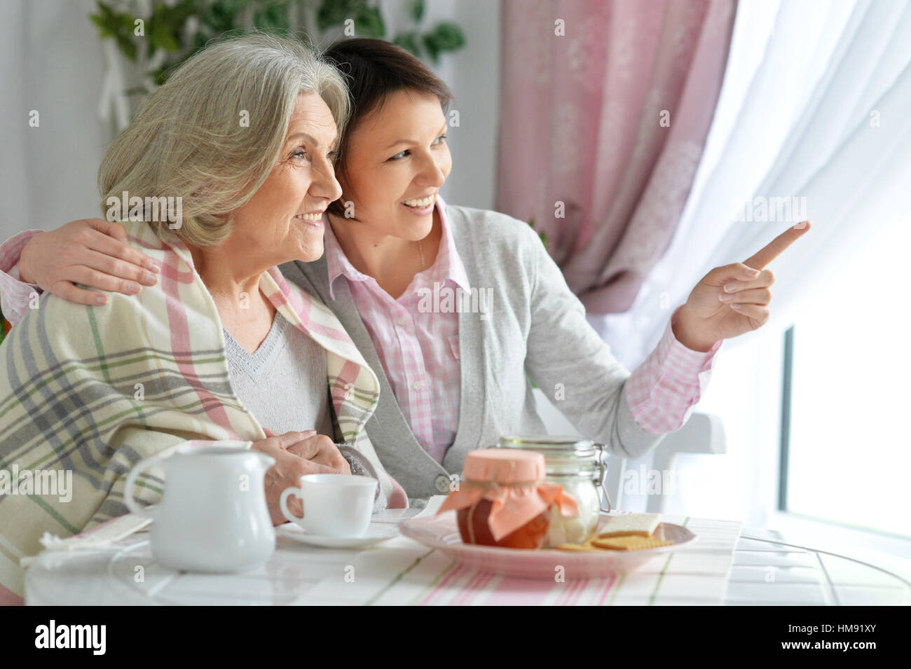 mother and daughter drinking tea Stock Photo - Alamy