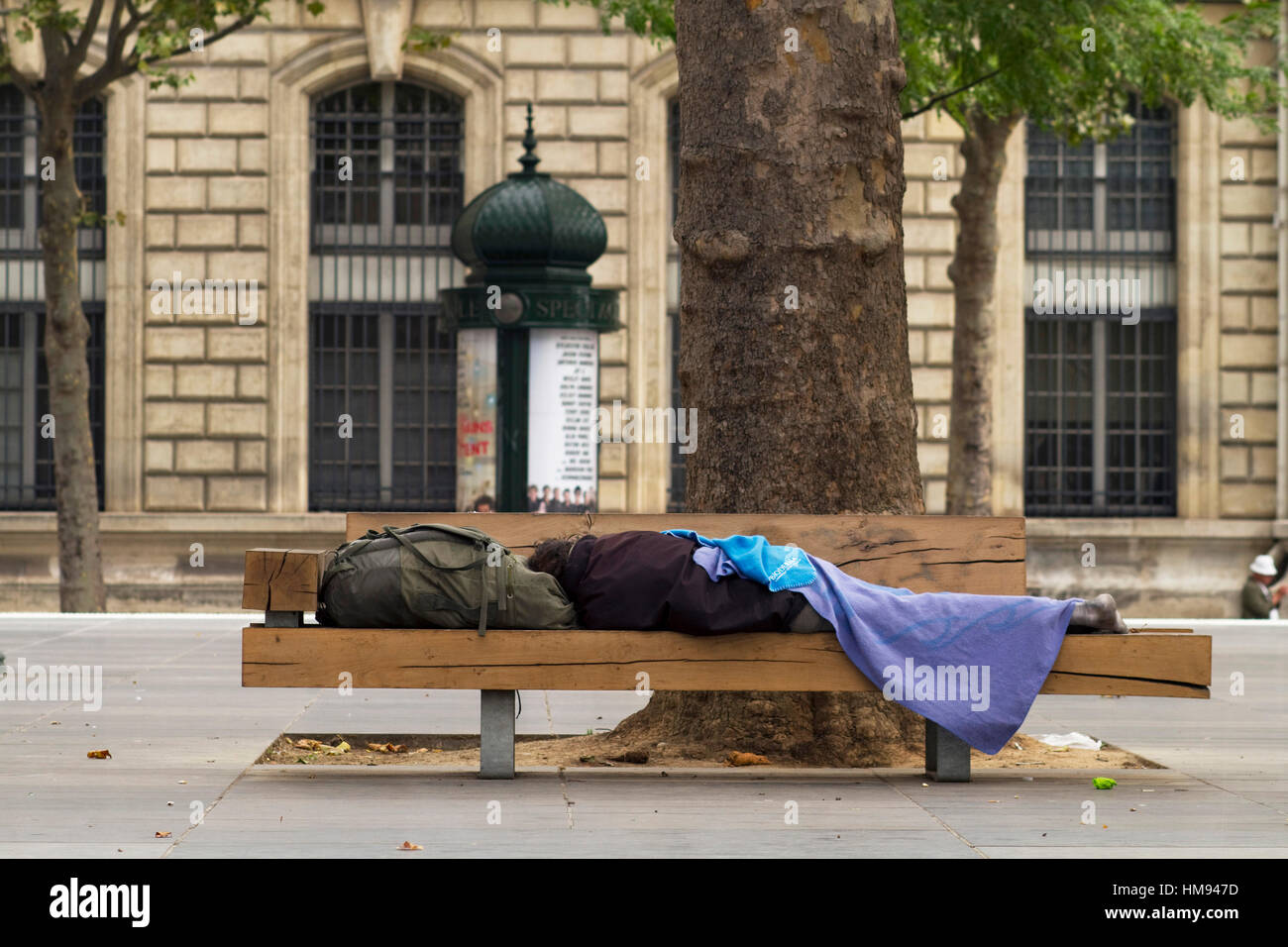 France, Paris, 3rd district, Place de la Republique, homeless man lying ...