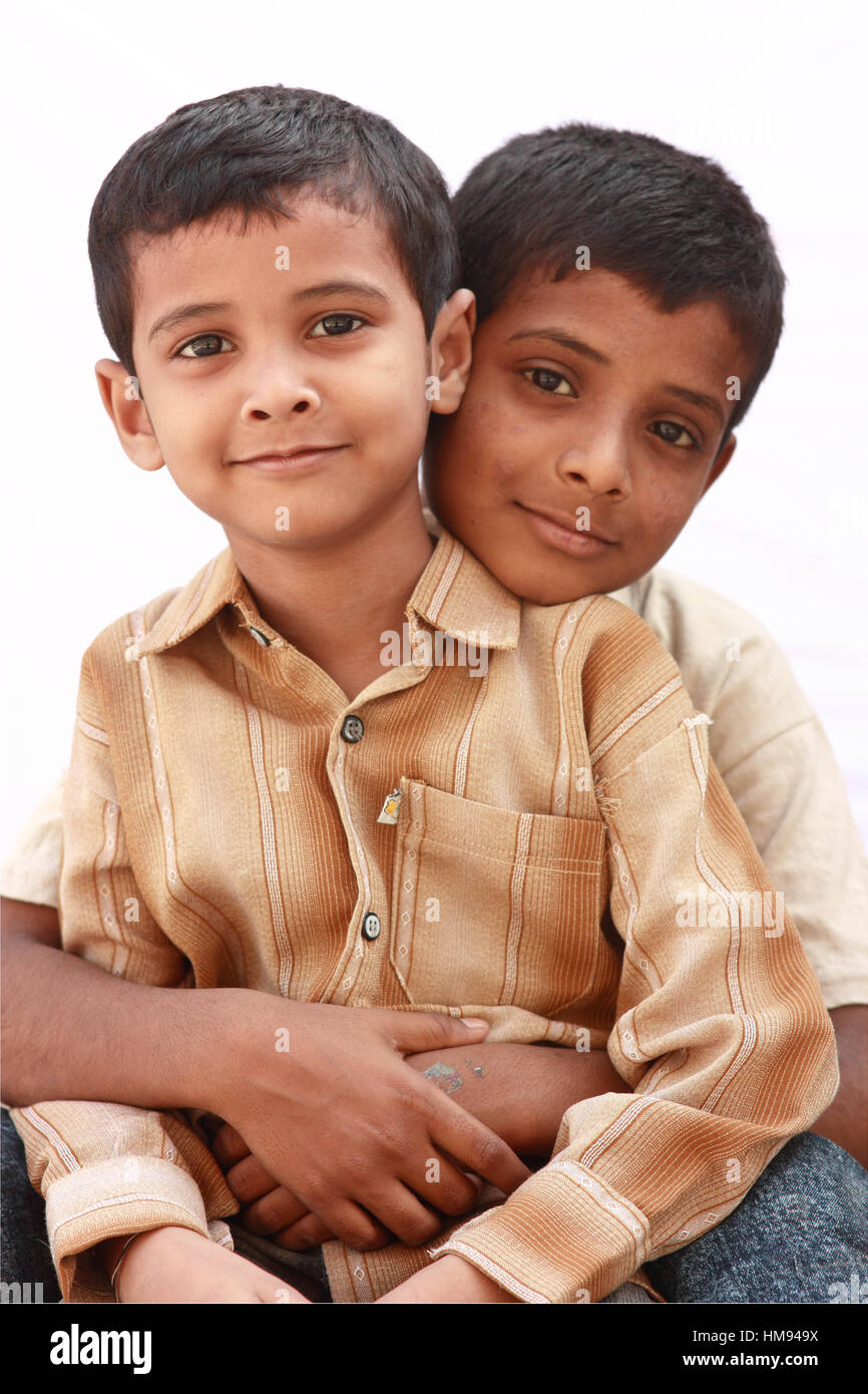 Elder brother holding younger Stock Photo - Alamy