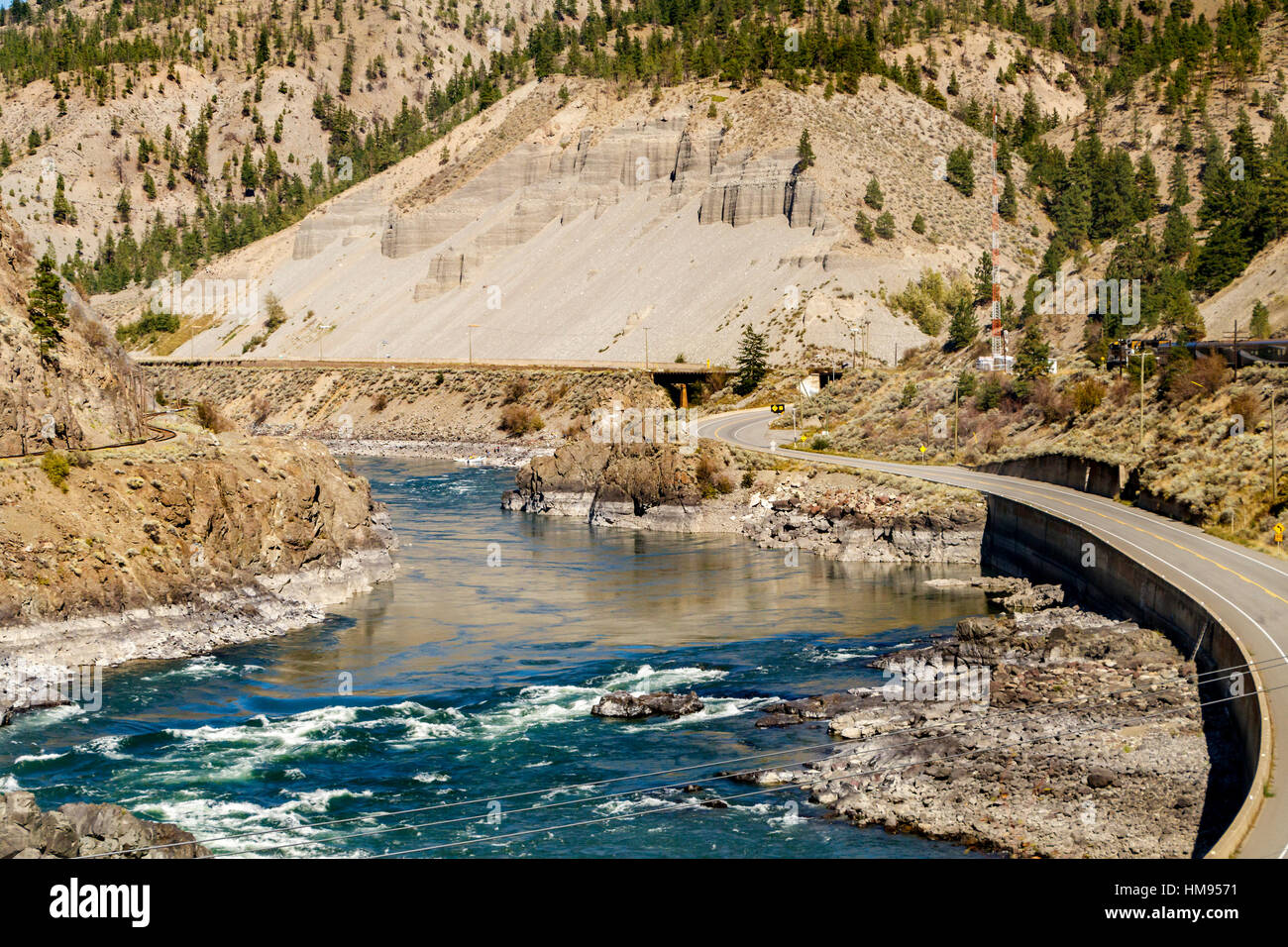 The Fraser Canyon mountains rising above the Fraser River in British ...