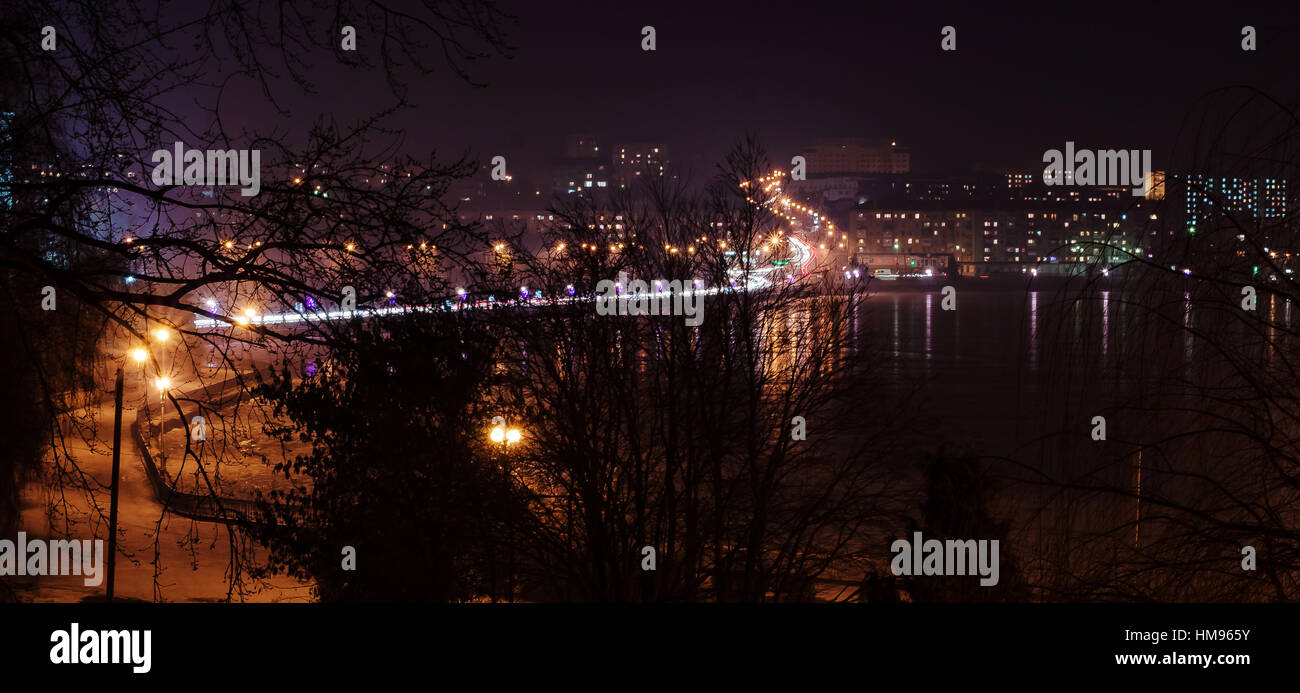 Panorama of night city lights and reflections on lake at Ternopil ...