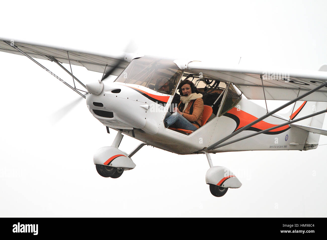Pilot young woman taking off on board of a microlight Stock Photo - Alamy