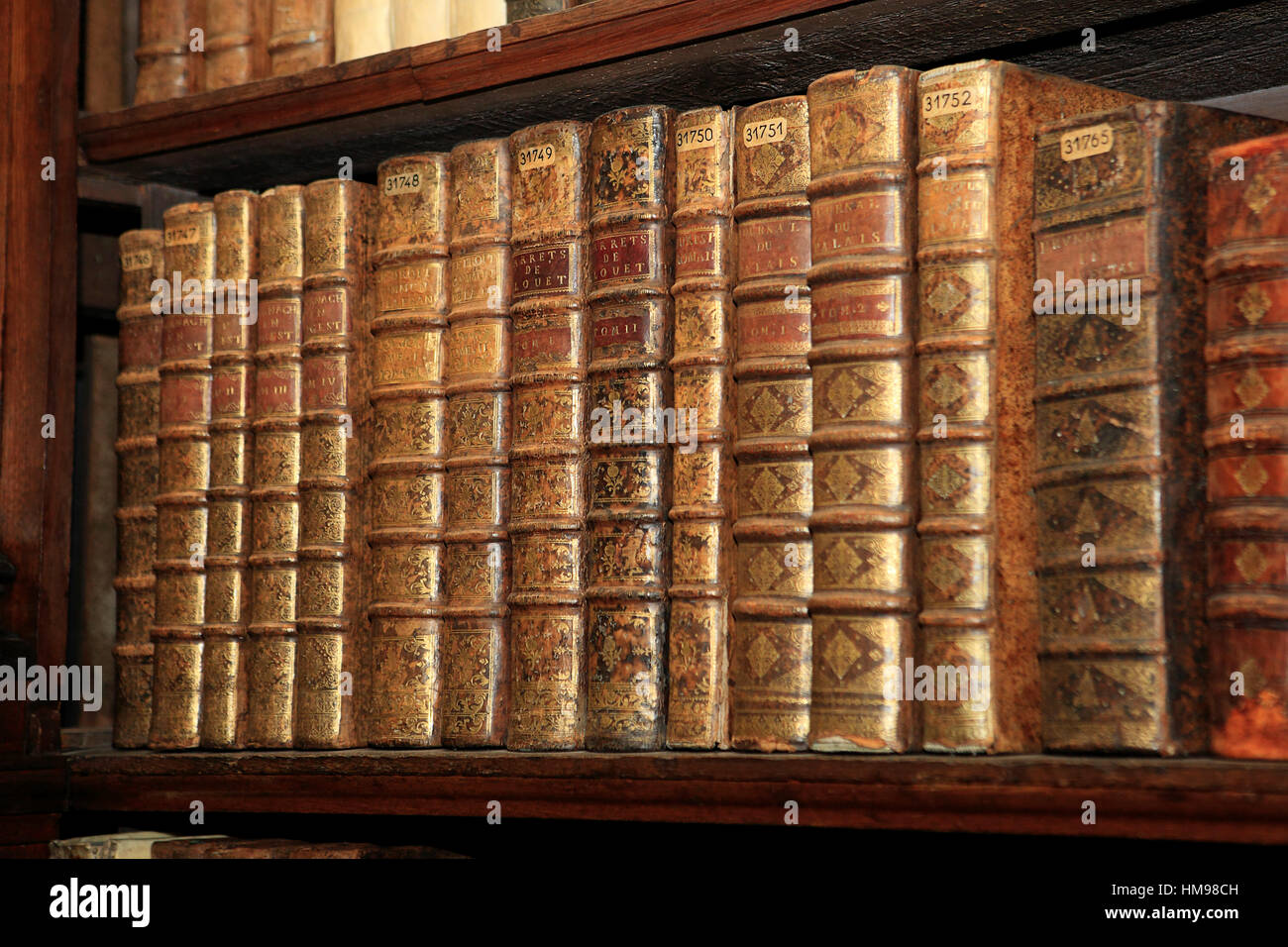 Old books in a library Stock Photo - Alamy