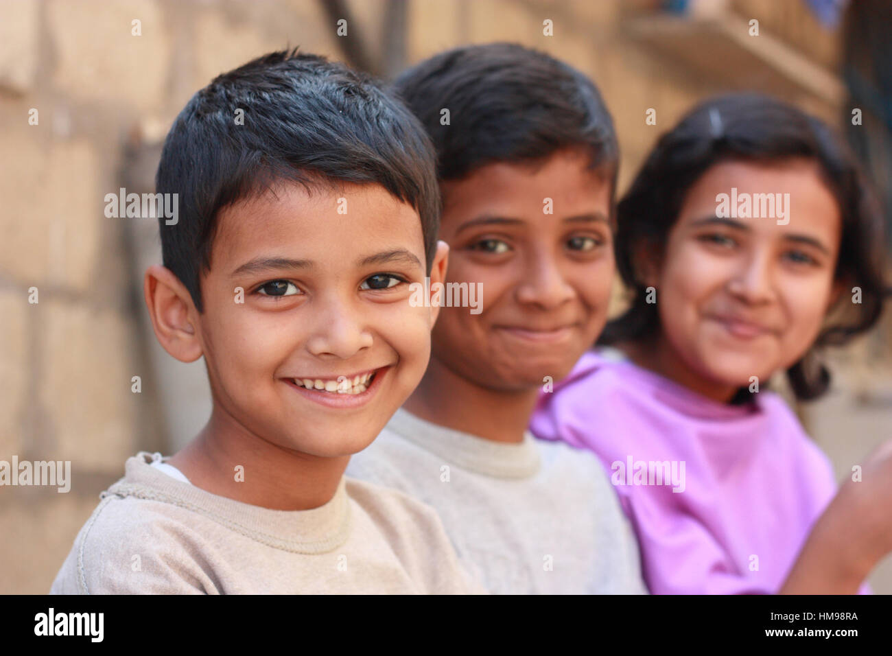 Pakistani siblings making pose and smile Stock Photo - Alamy