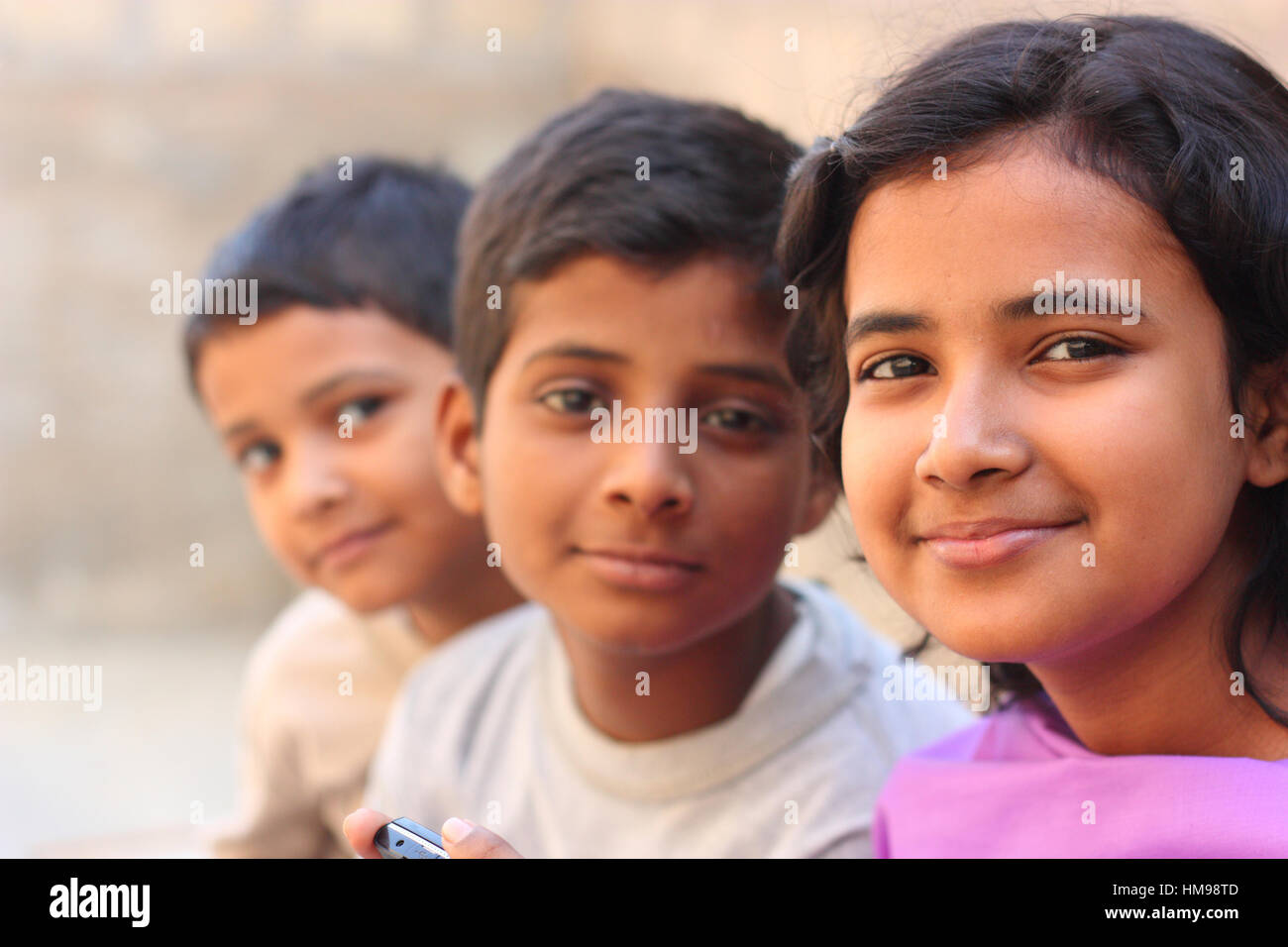 Pakistani siblings making pose and smile Stock Photo - Alamy