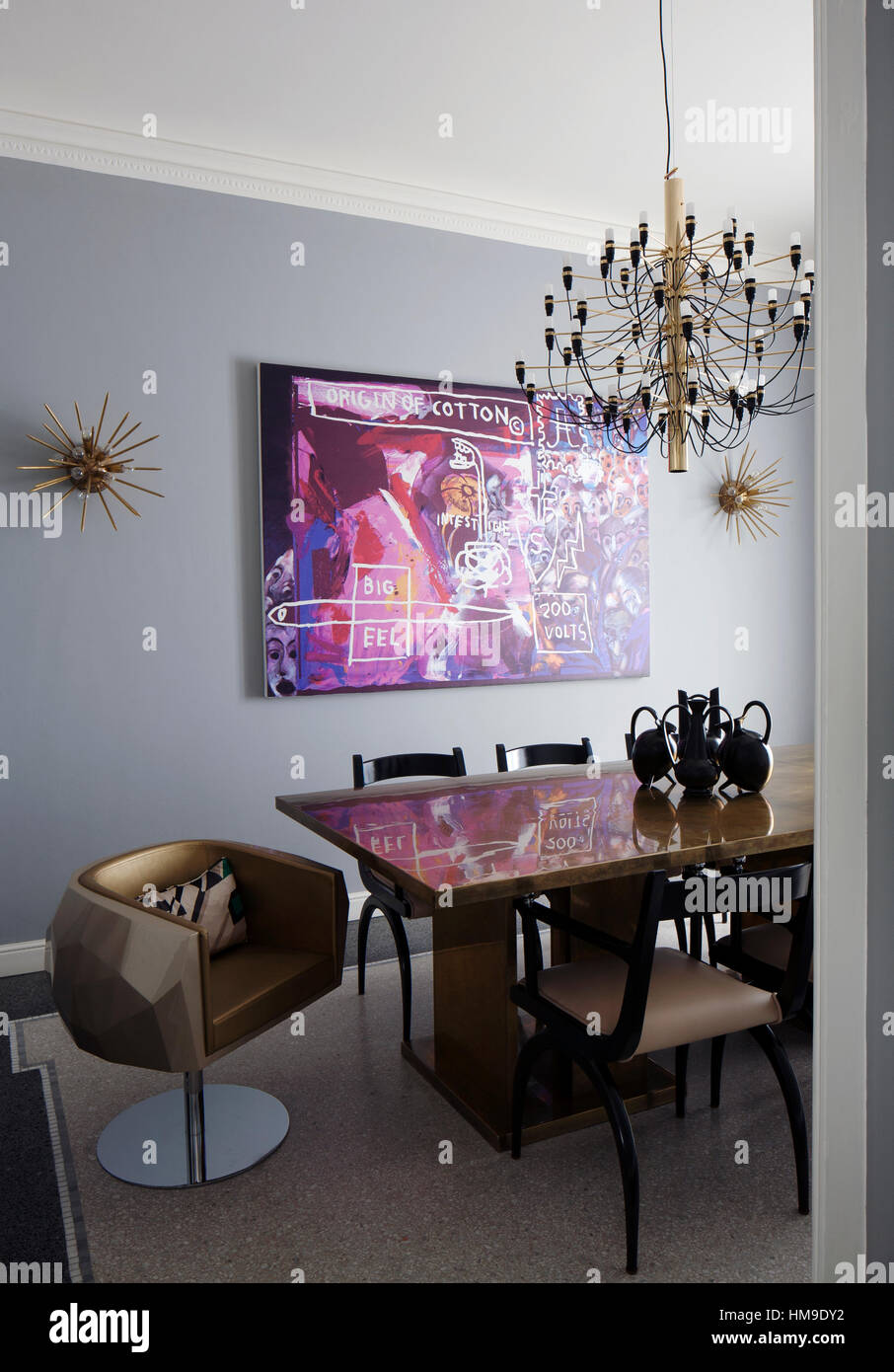 Interior of an apartment of a luxury living dining room with a Basquiat ...