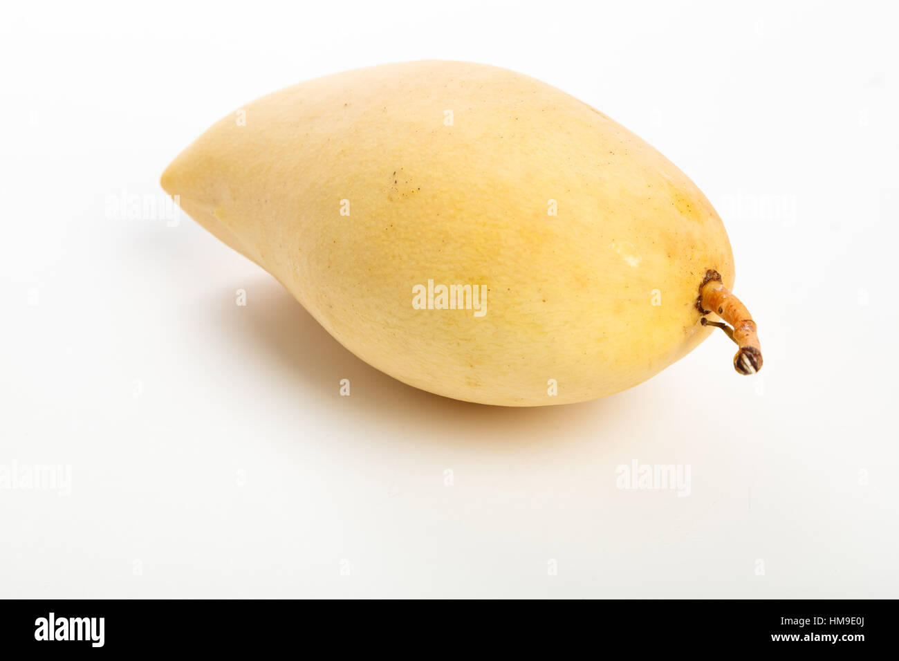 fresh yellow mango with white background, close up Stock Photo - Alamy