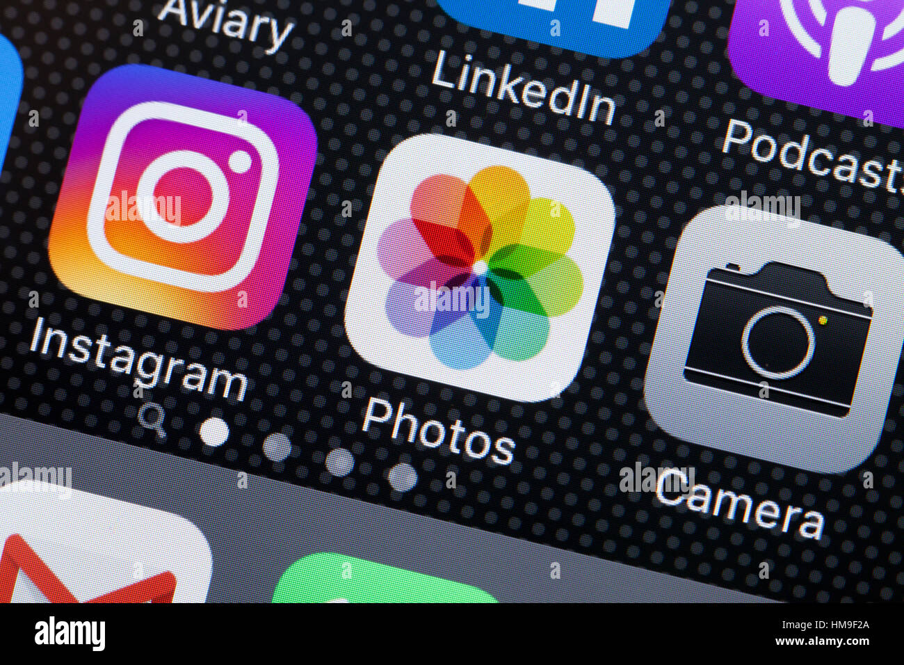 Photos app icon on iPhone screen - USA Stock Photo - Alamy