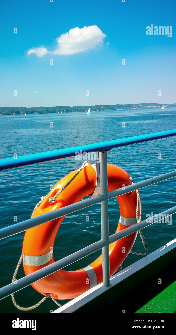 Lifebuoy on board ship at blue sky background Stock Photo - Alamy
