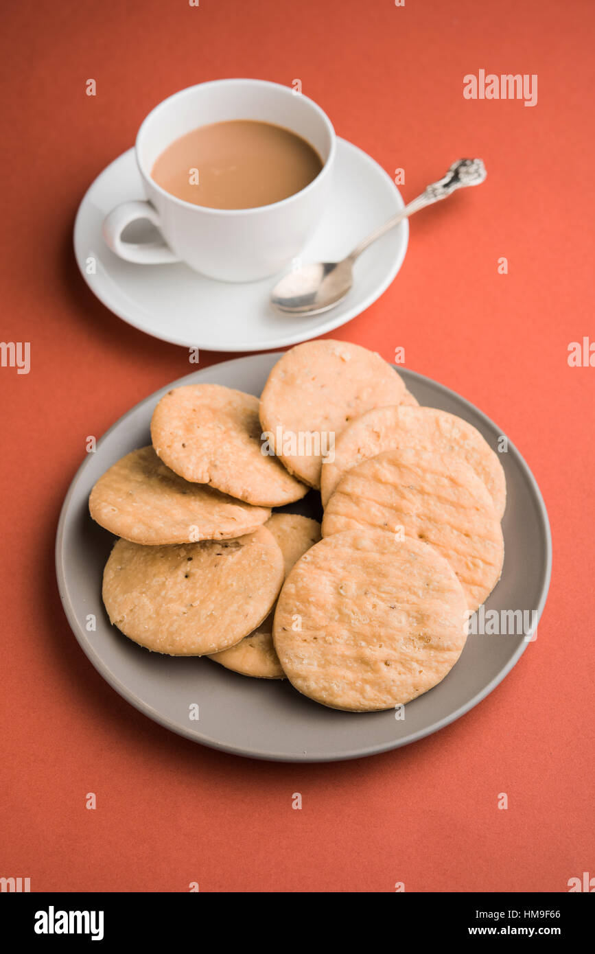 spicy fried mathri or mathari which is an indian snack served with a ...