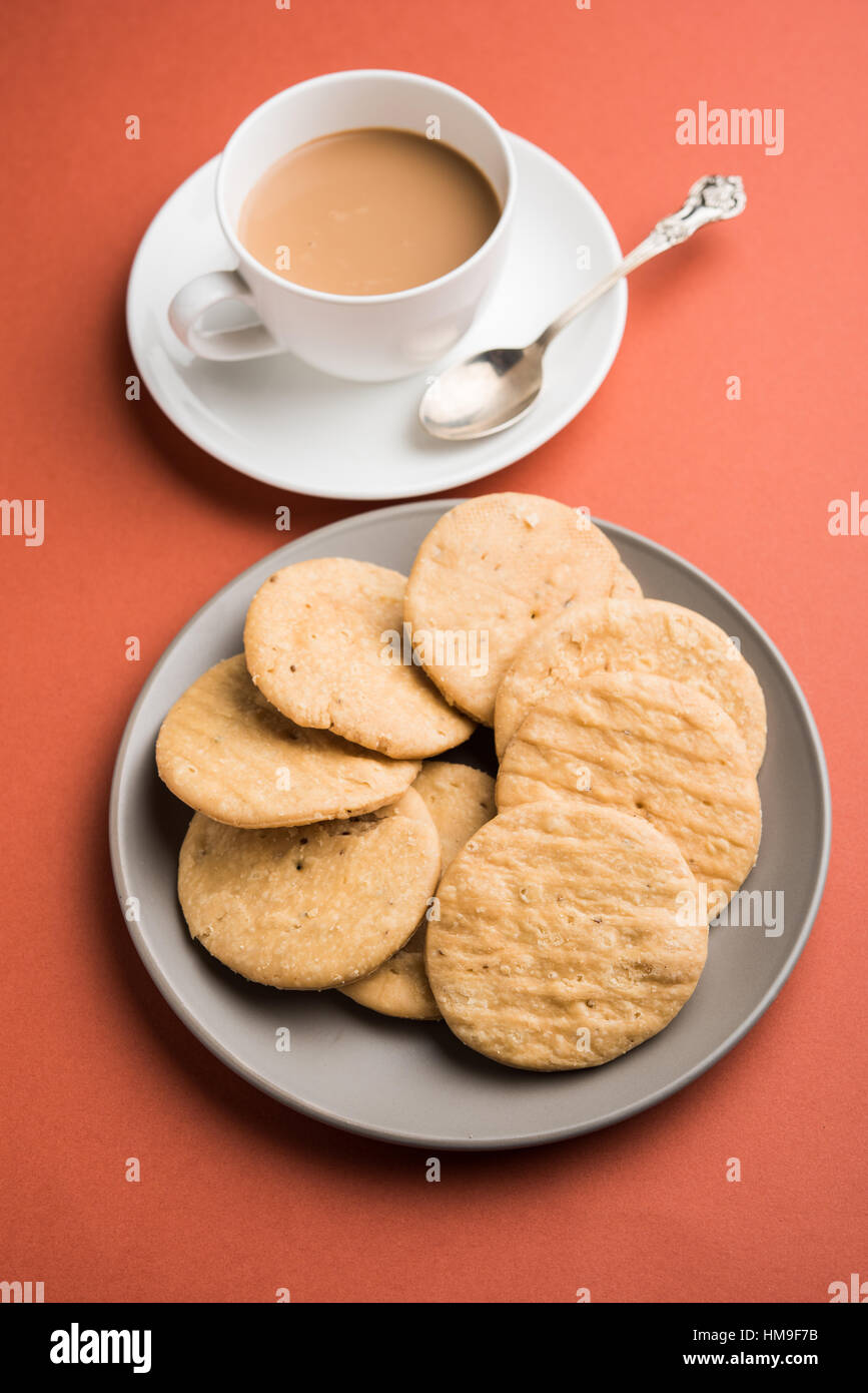 spicy fried mathri or mathari which is an indian snack served with a ...