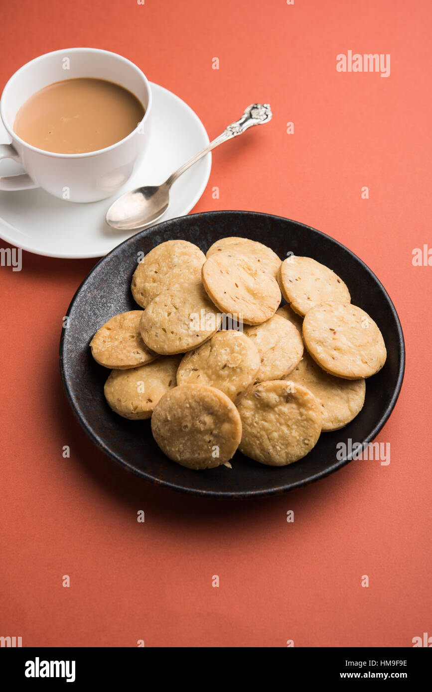 spicy fried mathri or mathari which is an indian snack served with a ...