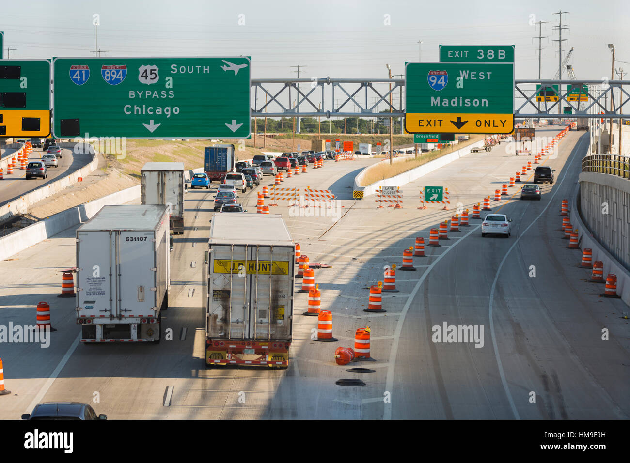 Interstate construction with merging lanes and orange cones Stock Photo ...