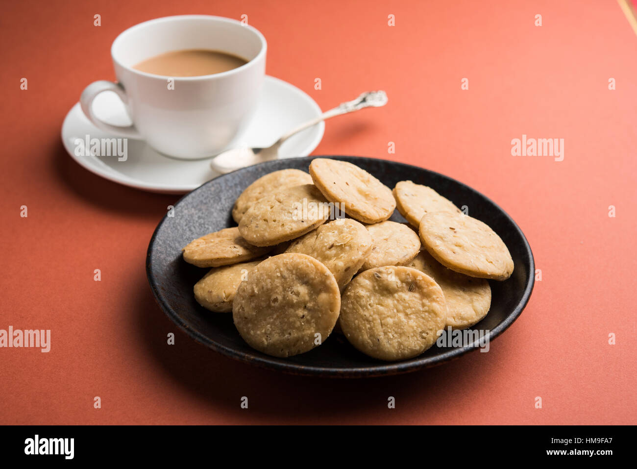 spicy fried mathri or mathari which is an indian snack served with a ...
