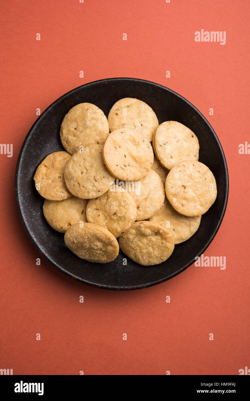 spicy fried mathri or mathari which is an indian snack served with a ...