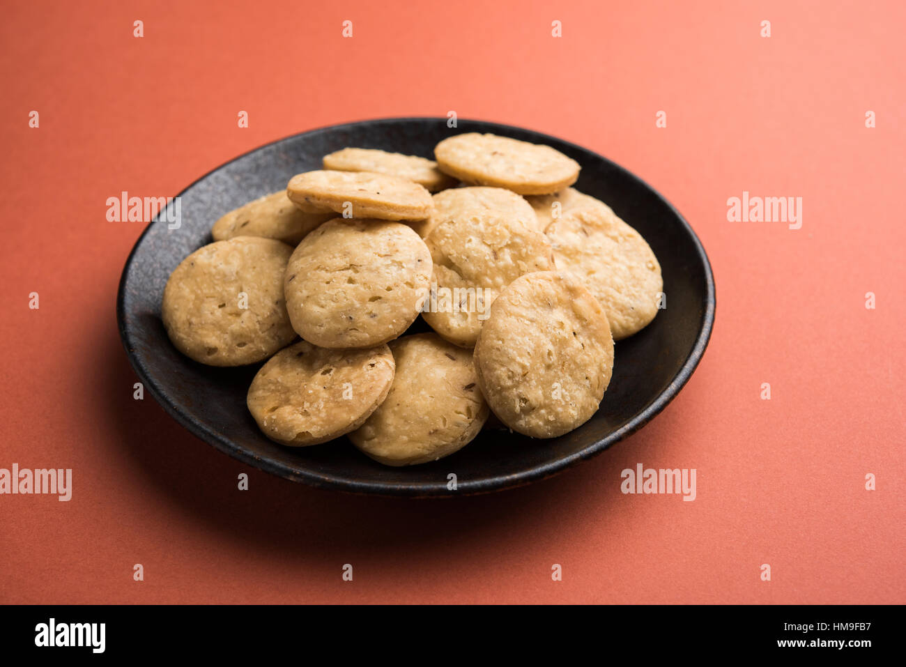 spicy fried mathri or mathari which is an indian snack served with a ...