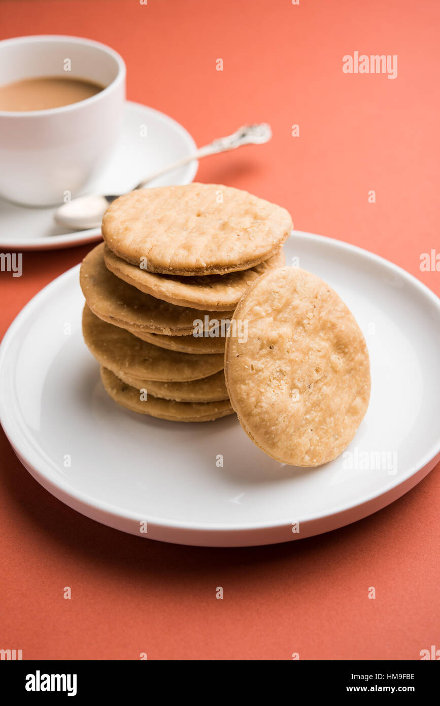 spicy fried mathri or mathari which is an indian snack served with a ...