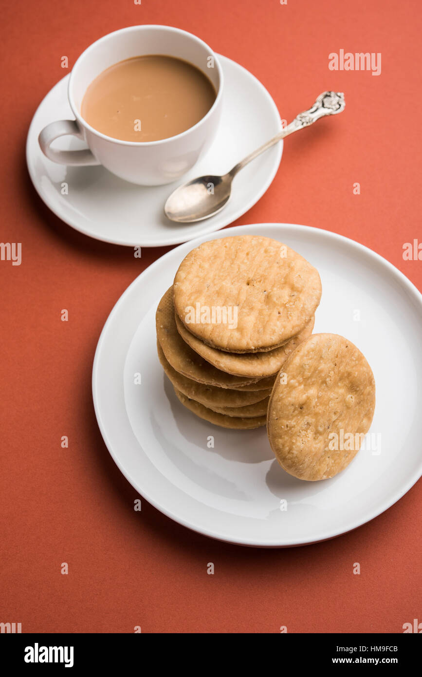 spicy fried mathri or mathari which is an indian snack served with a ...