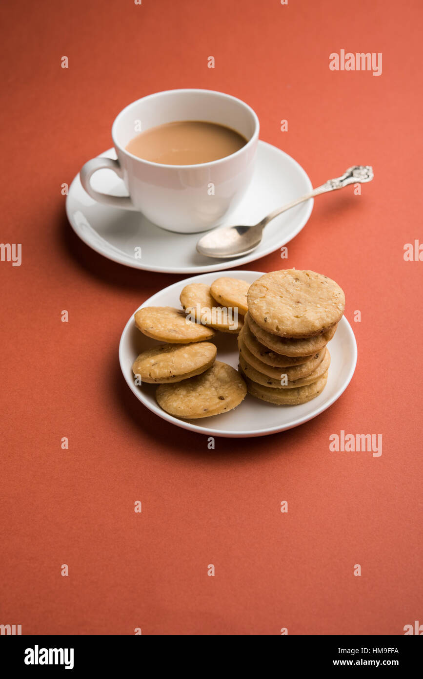 spicy fried mathri or mathari which is an indian snack served with a ...