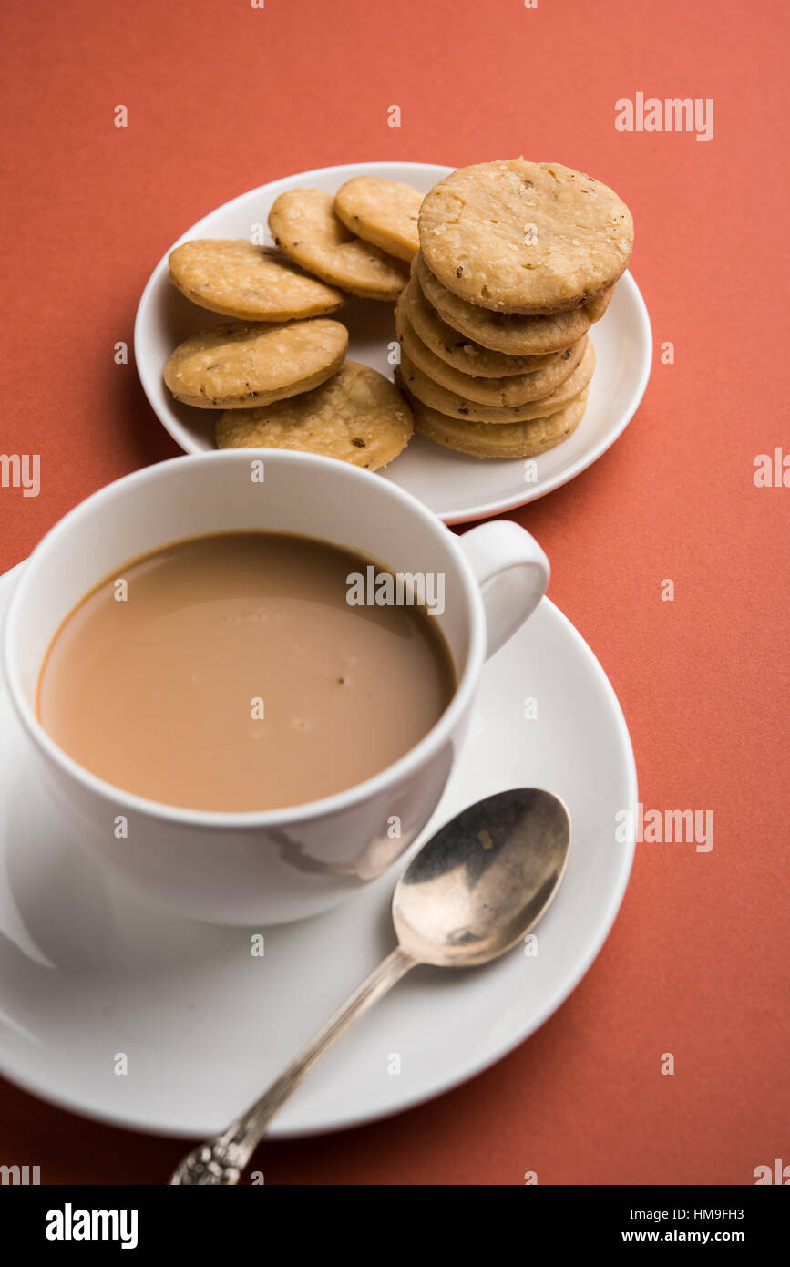 spicy fried mathri or mathari which is an indian snack served with a ...