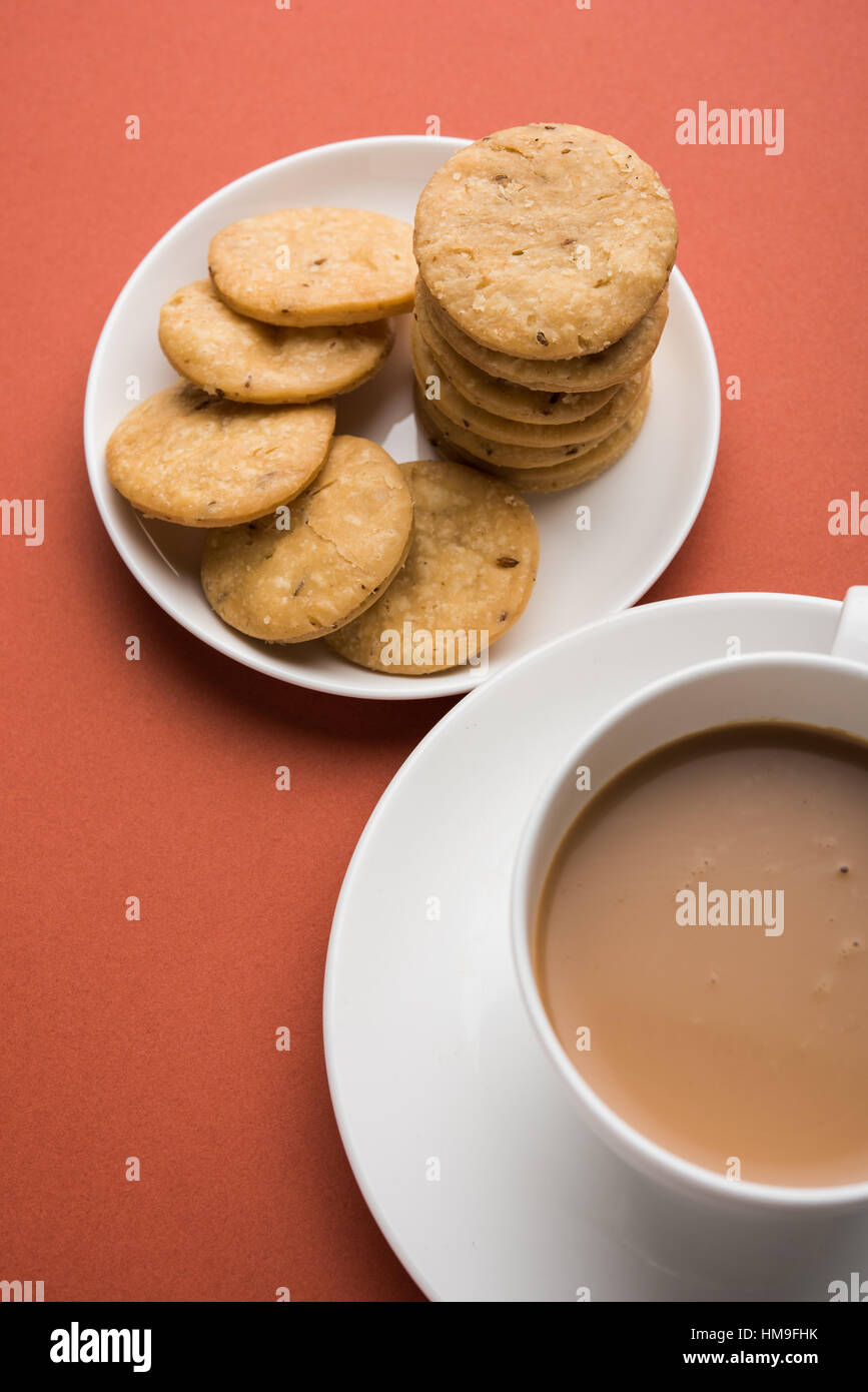 spicy fried mathri or mathari which is an indian snack served with a ...