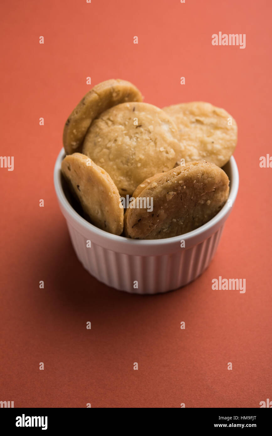 spicy fried mathri or mathari which is an indian snack served with a ...