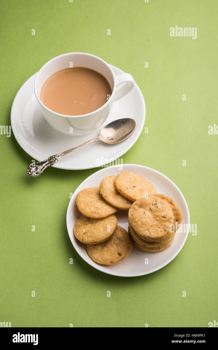 spicy fried mathri or mathari which is an indian snack served with a ...