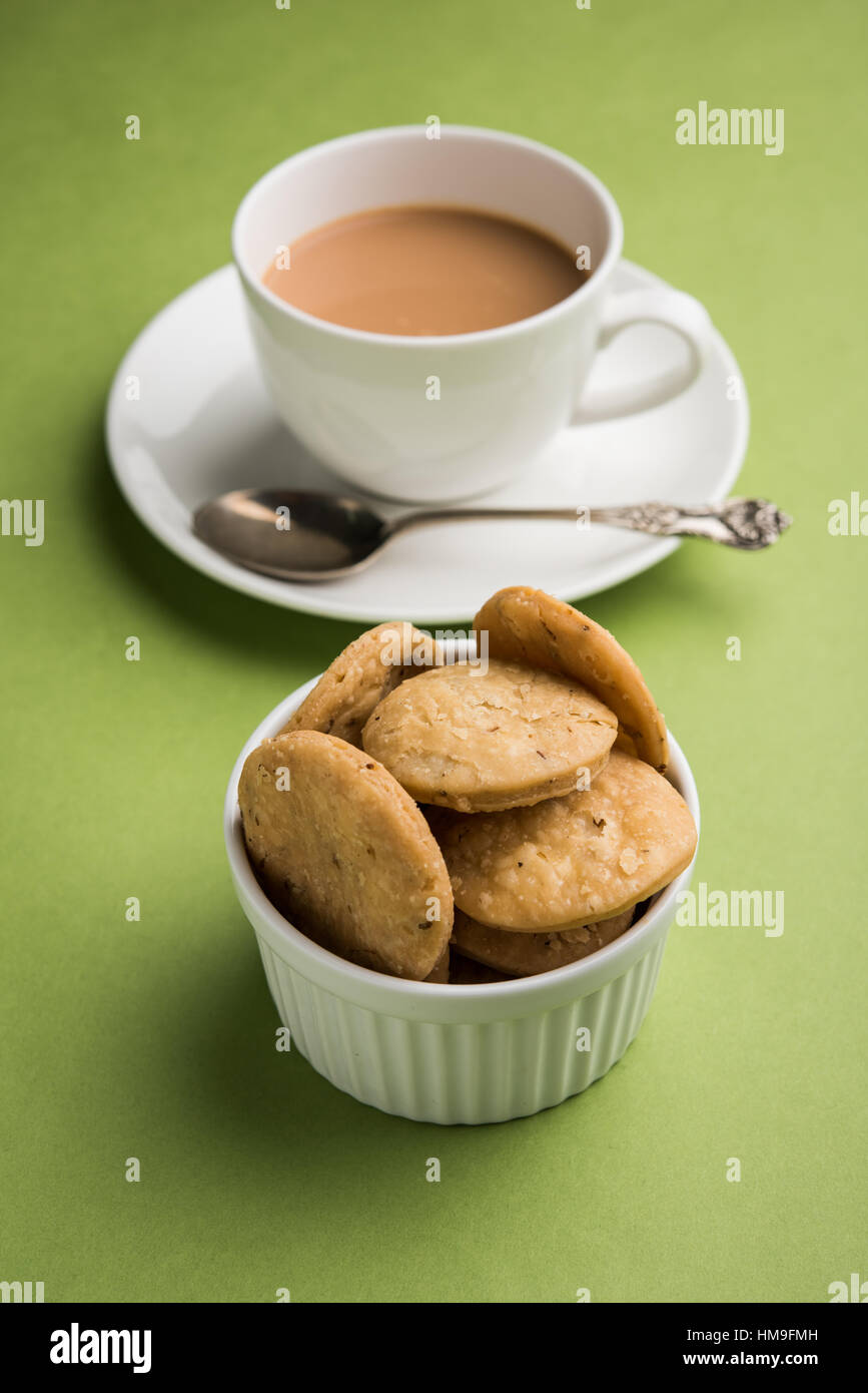 spicy fried mathri or mathari which is an indian snack served with a ...