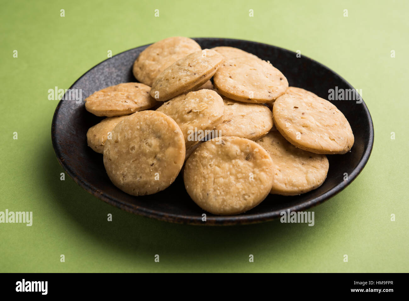spicy fried mathri or mathari which is an indian snack served with a ...
