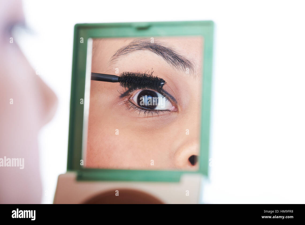 Woman putting on lipstick in hi-res stock photography and images - Alamy