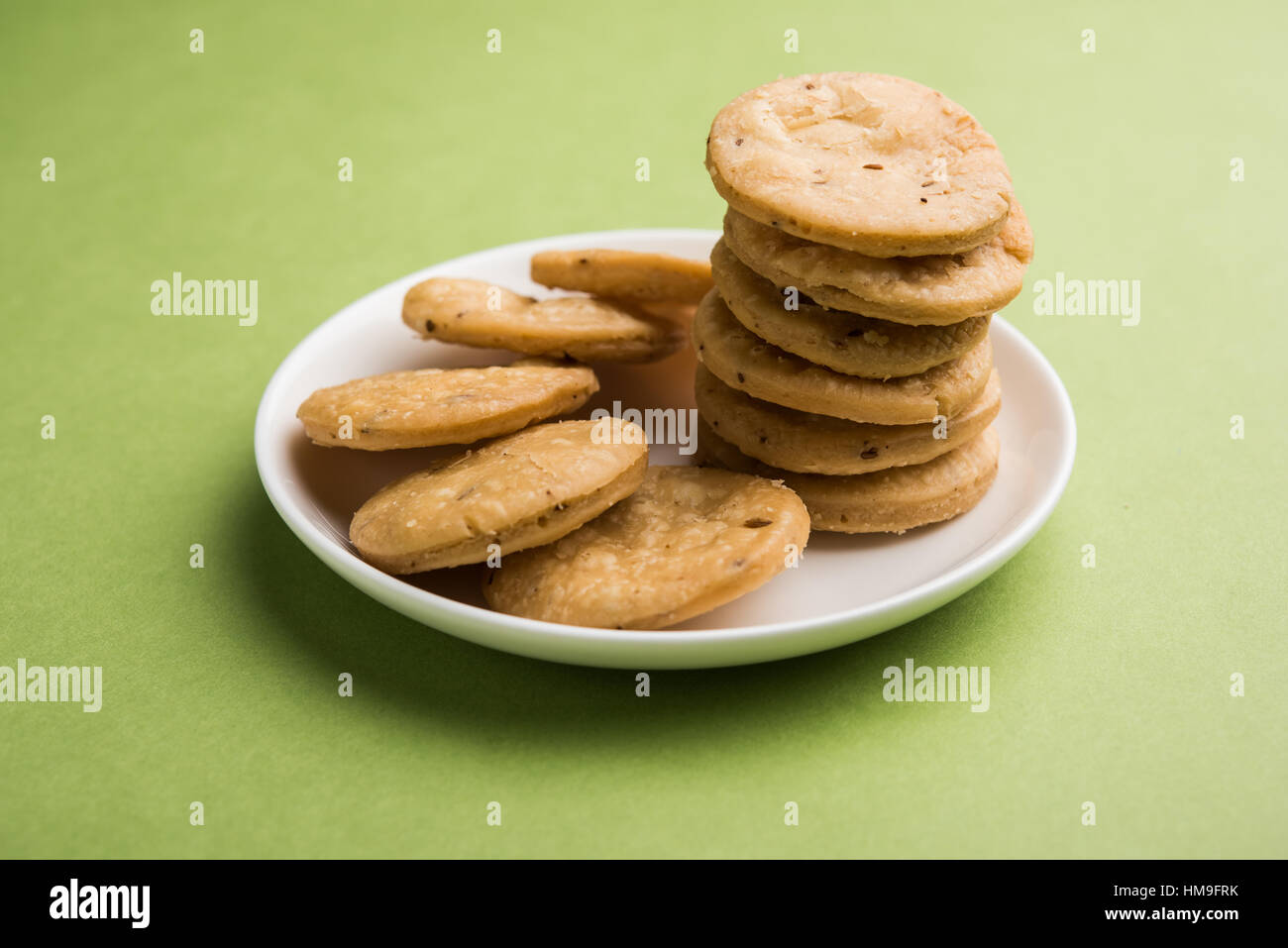 spicy fried mathri or mathari which is an indian snack served with a ...