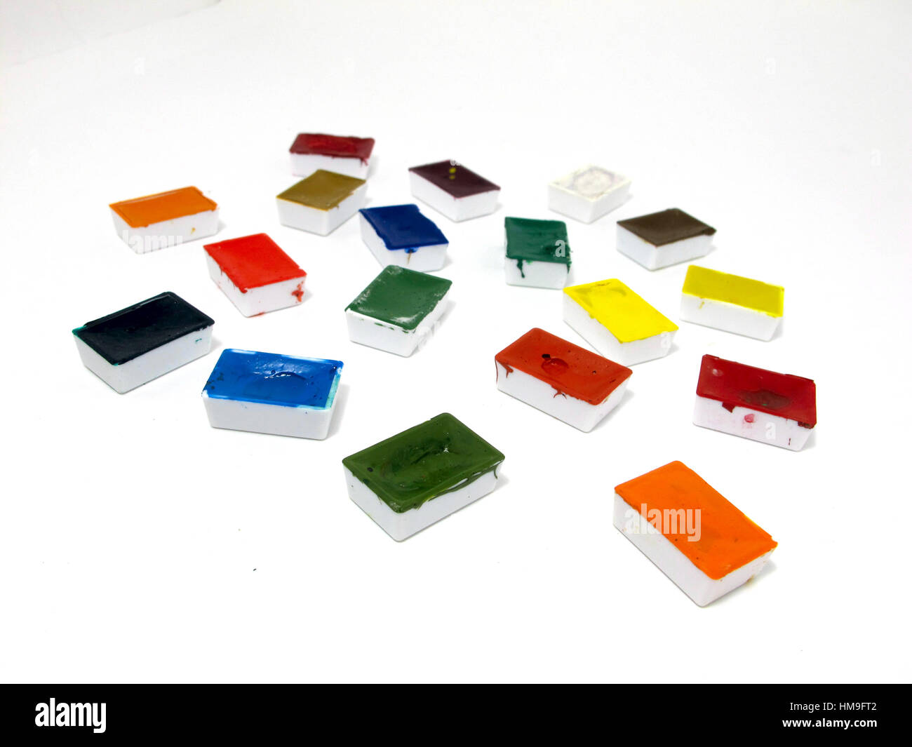 Paint cuvette on white background. Colorful watercolor in a chaotic ...