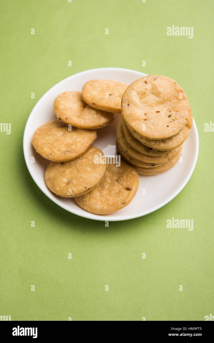 spicy fried mathri or mathari which is an indian snack served with a ...