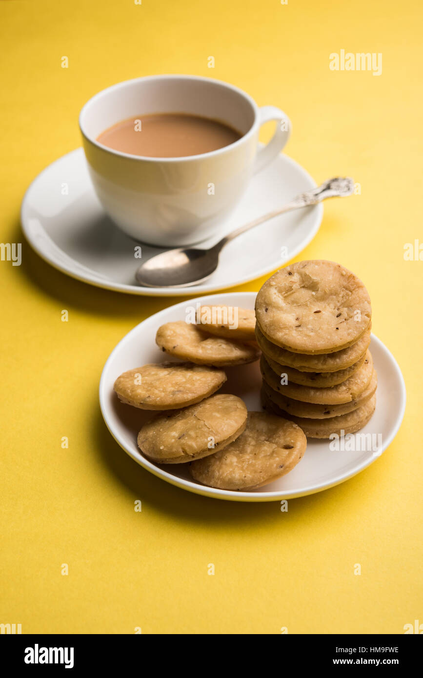 spicy fried mathri or mathari which is an indian snack served with a ...