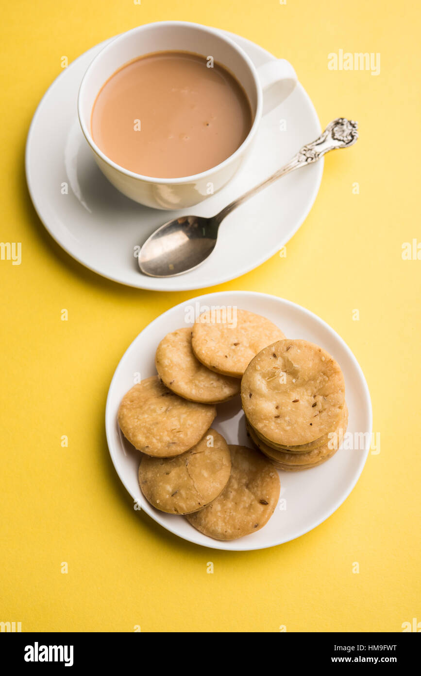 spicy fried mathri or mathari which is an indian snack served with a ...