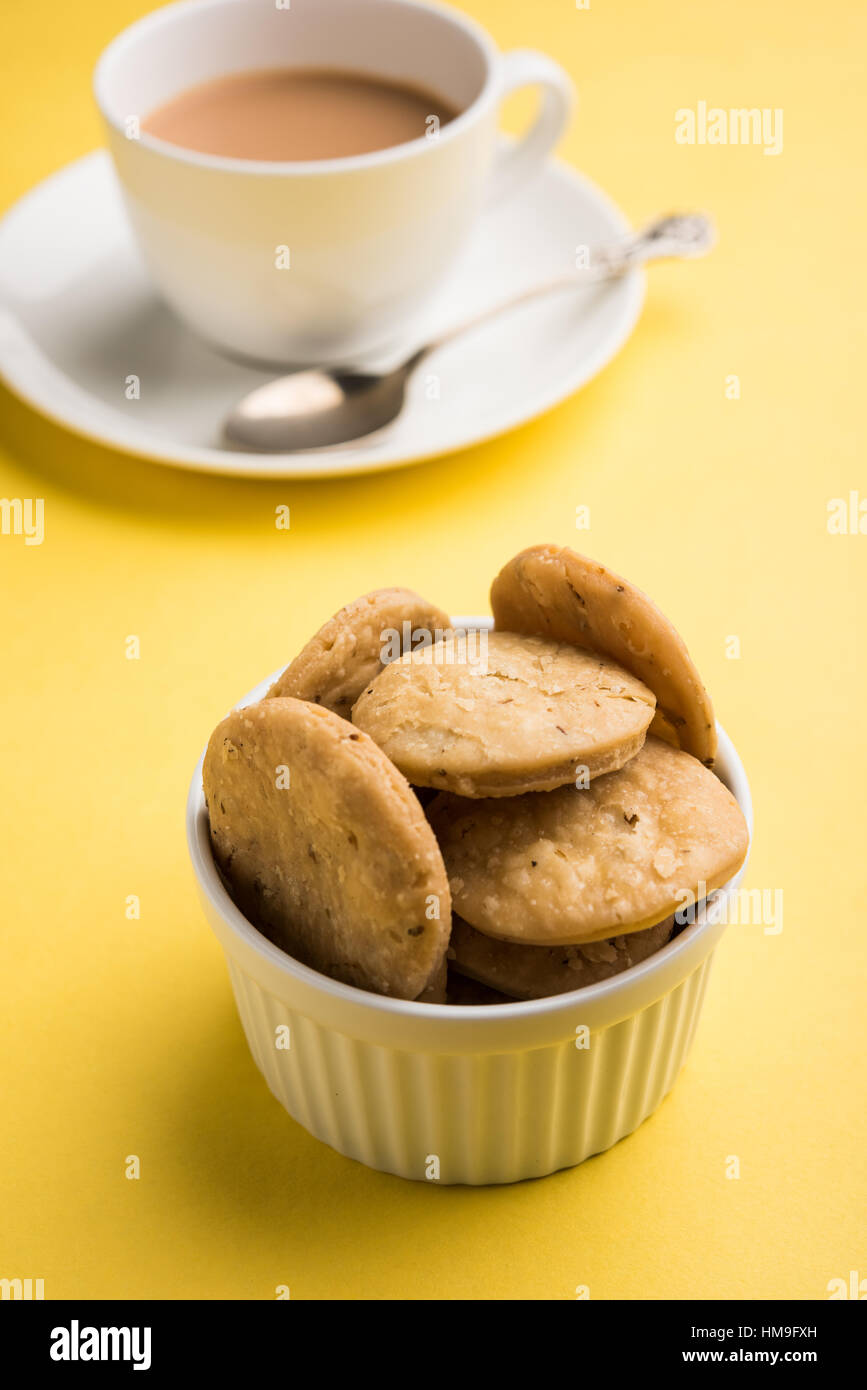 spicy fried mathri or mathari which is an indian snack served with a ...
