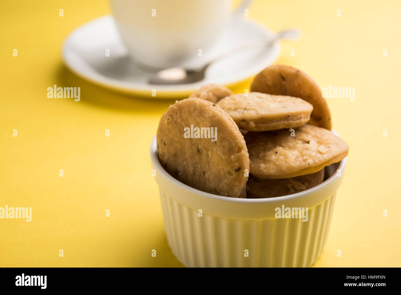 spicy fried mathri or mathari which is an indian snack served with a ...