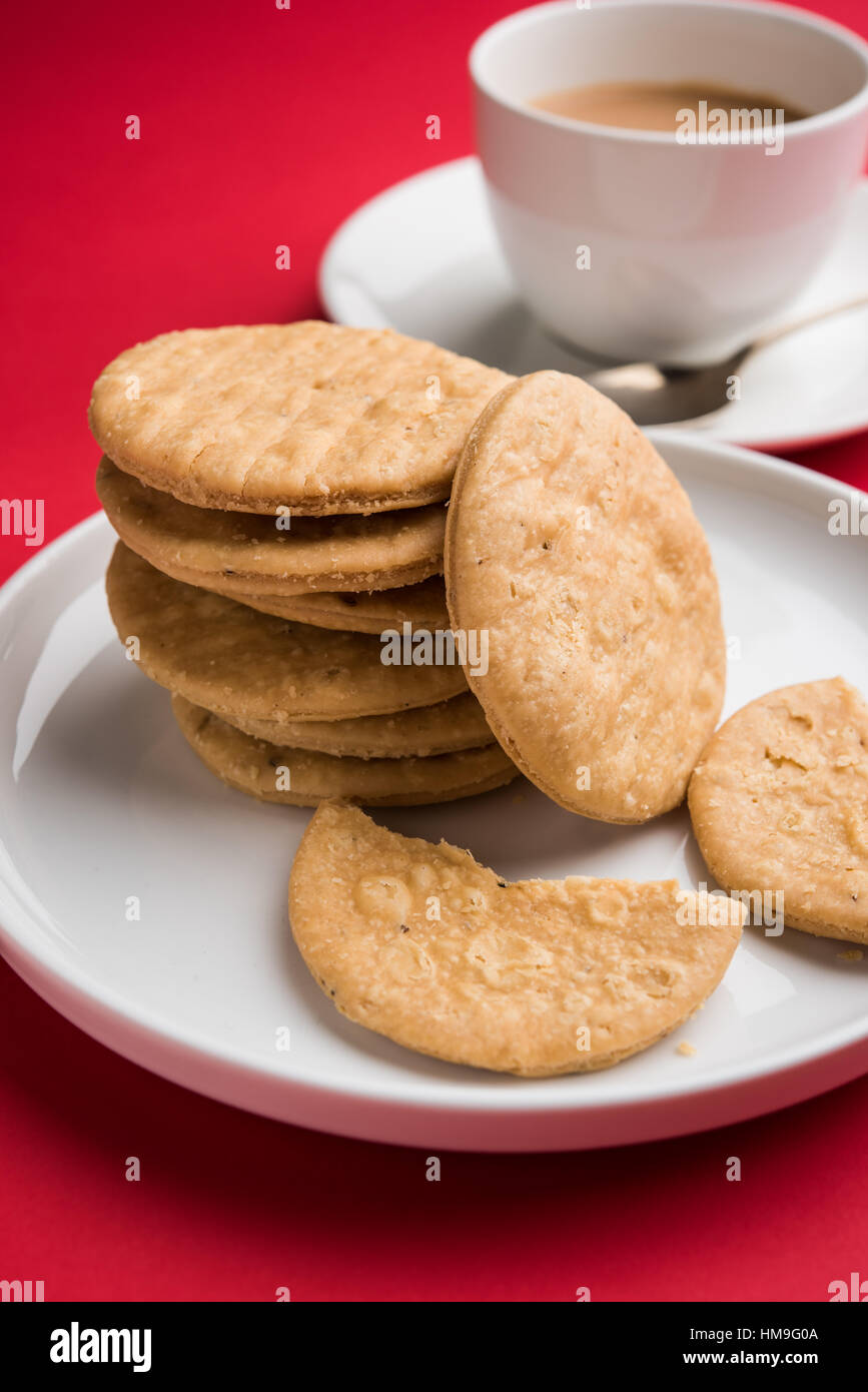 spicy fried mathri or mathari which is an indian snack served with a ...