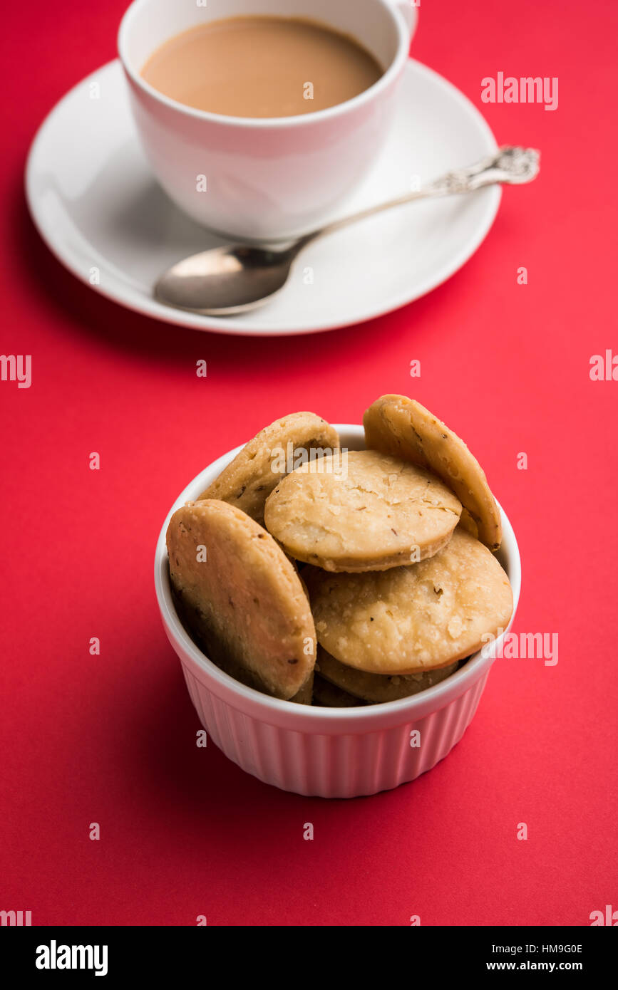 spicy fried mathri or mathari which is an indian snack served with a ...