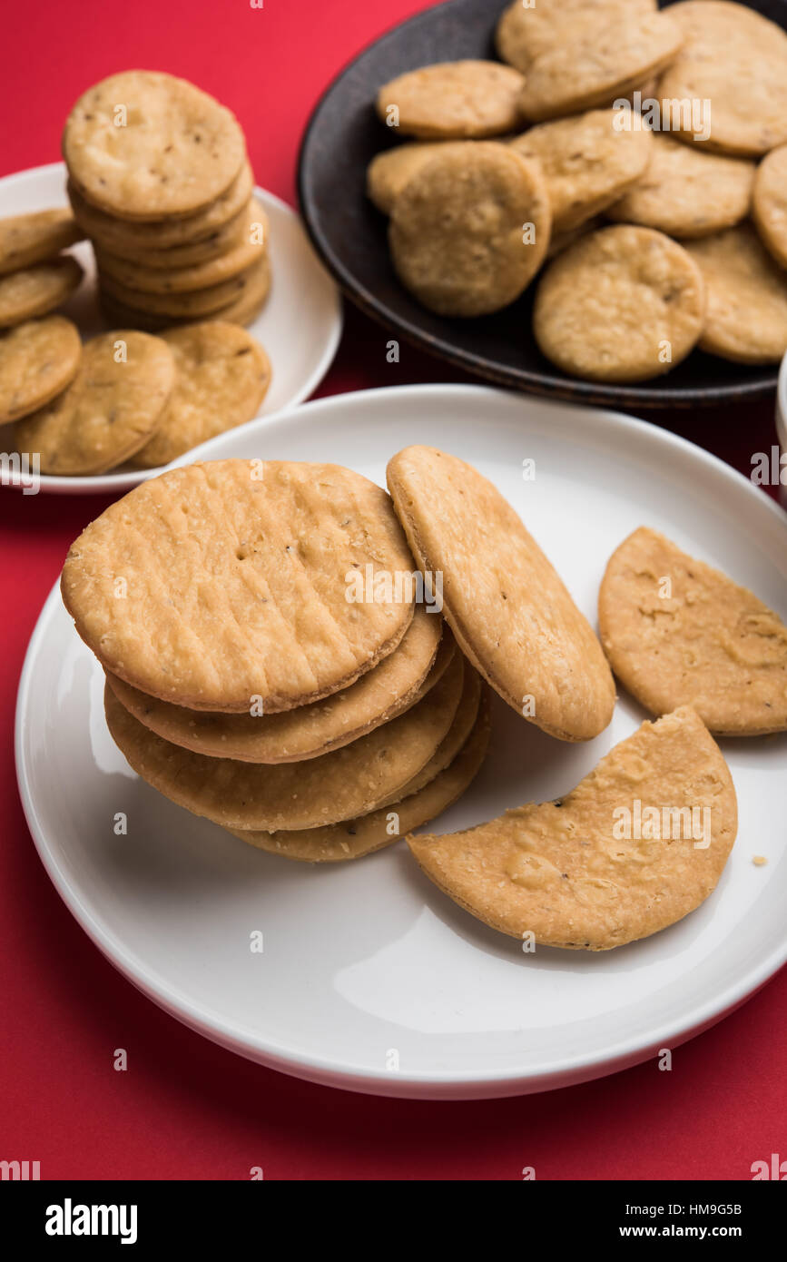spicy fried mathri or mathari which is an indian snack served with a ...