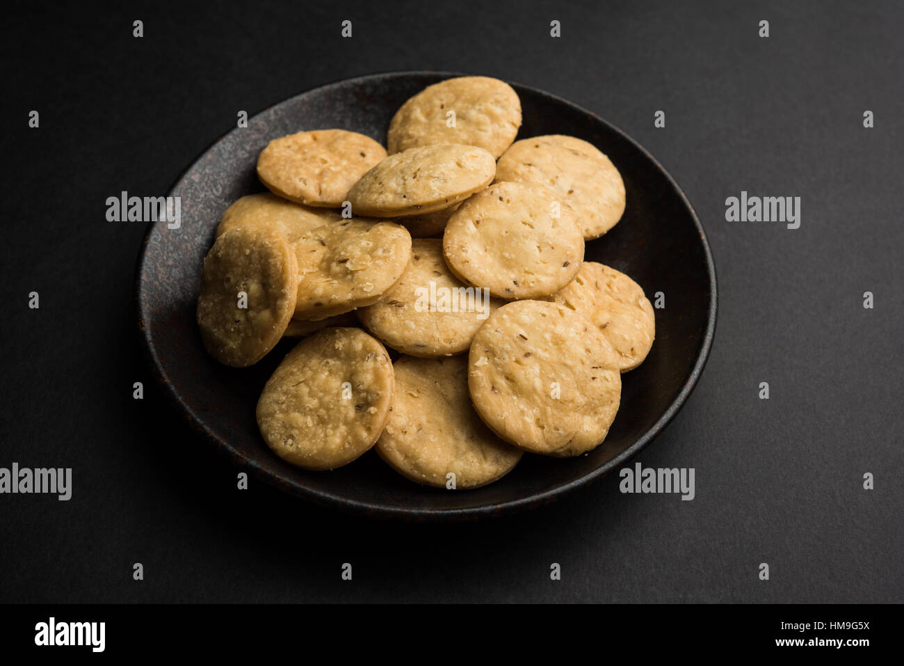 spicy fried mathri or mathari which is an indian snack served with a ...