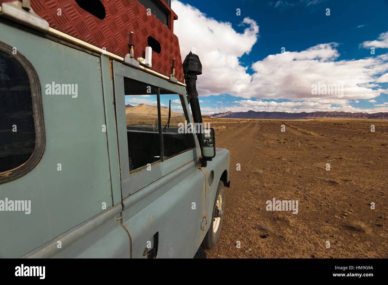 Offroad vehicle oldtimer driving off road in Morocco Stock Photo - Alamy