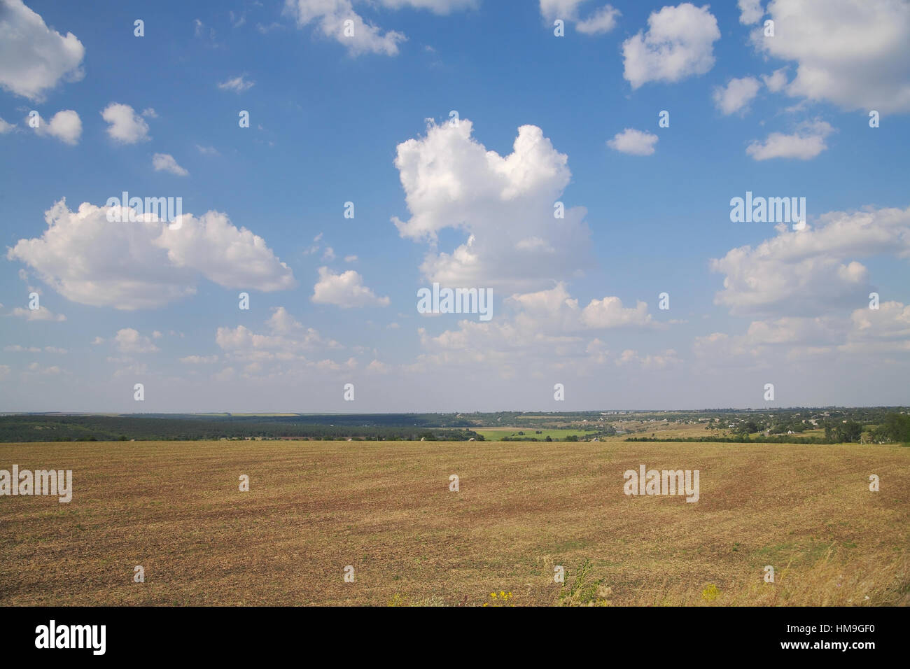 Rural landscape, field and clouds in the sky Stock Photo - Alamy